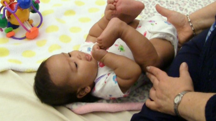 Pathways.org | Meeting Milestones – Encourage Baby to Bring Hands to Feet